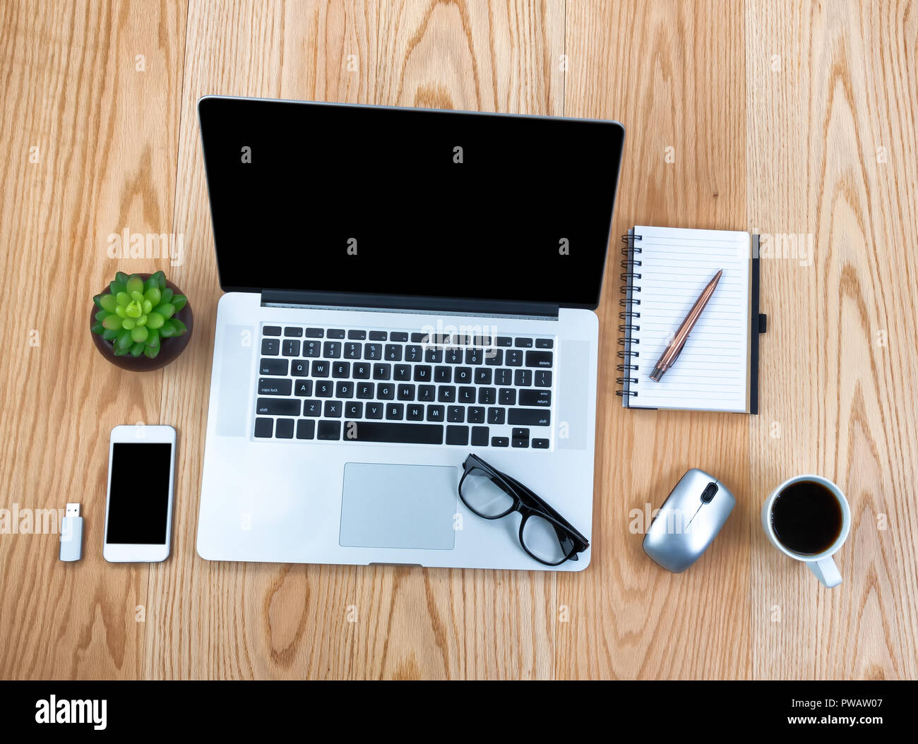 Overhead view of oak desktop with modern wireless technologies Stock ...