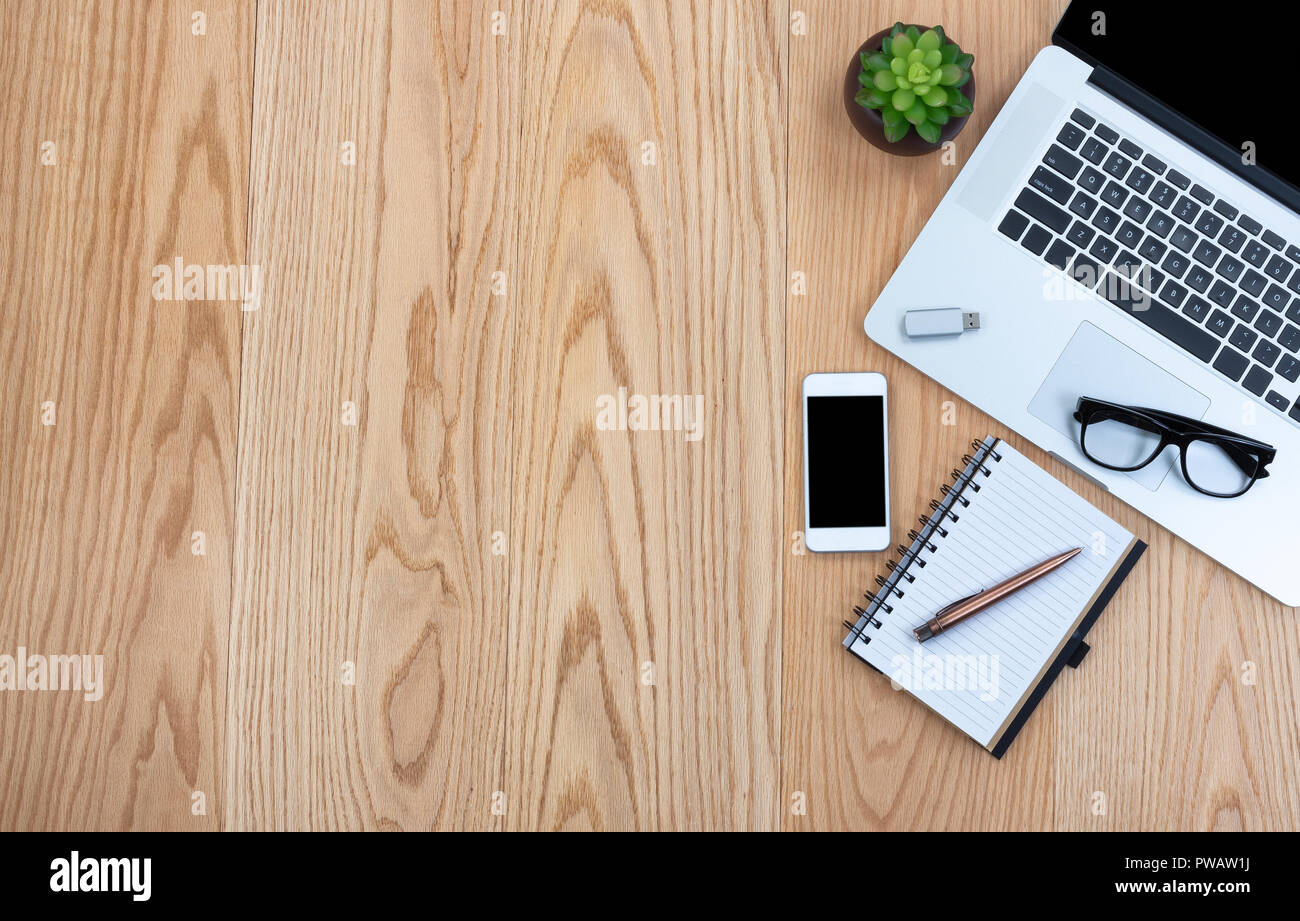 Basic office technology and writing stationery on wooden desktop Stock ...