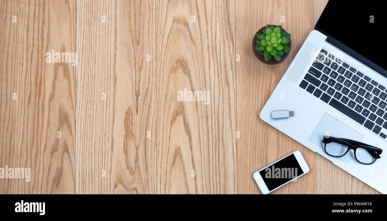 Overhead view of basic mobile office technology on wooden desktop Stock ...