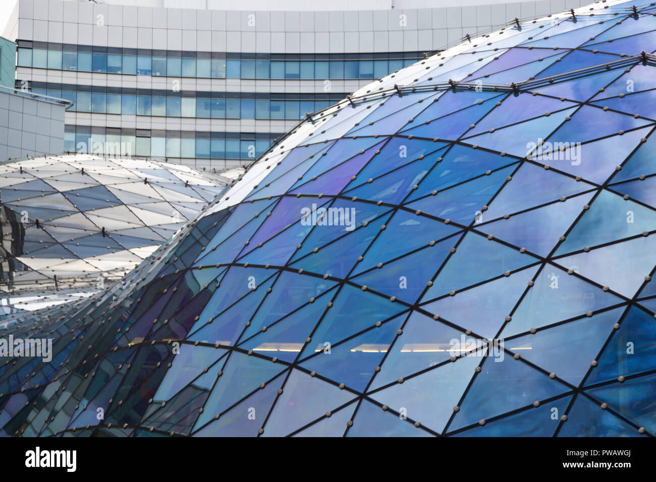 Wide angle abstract background view of steel light blue high rise ...