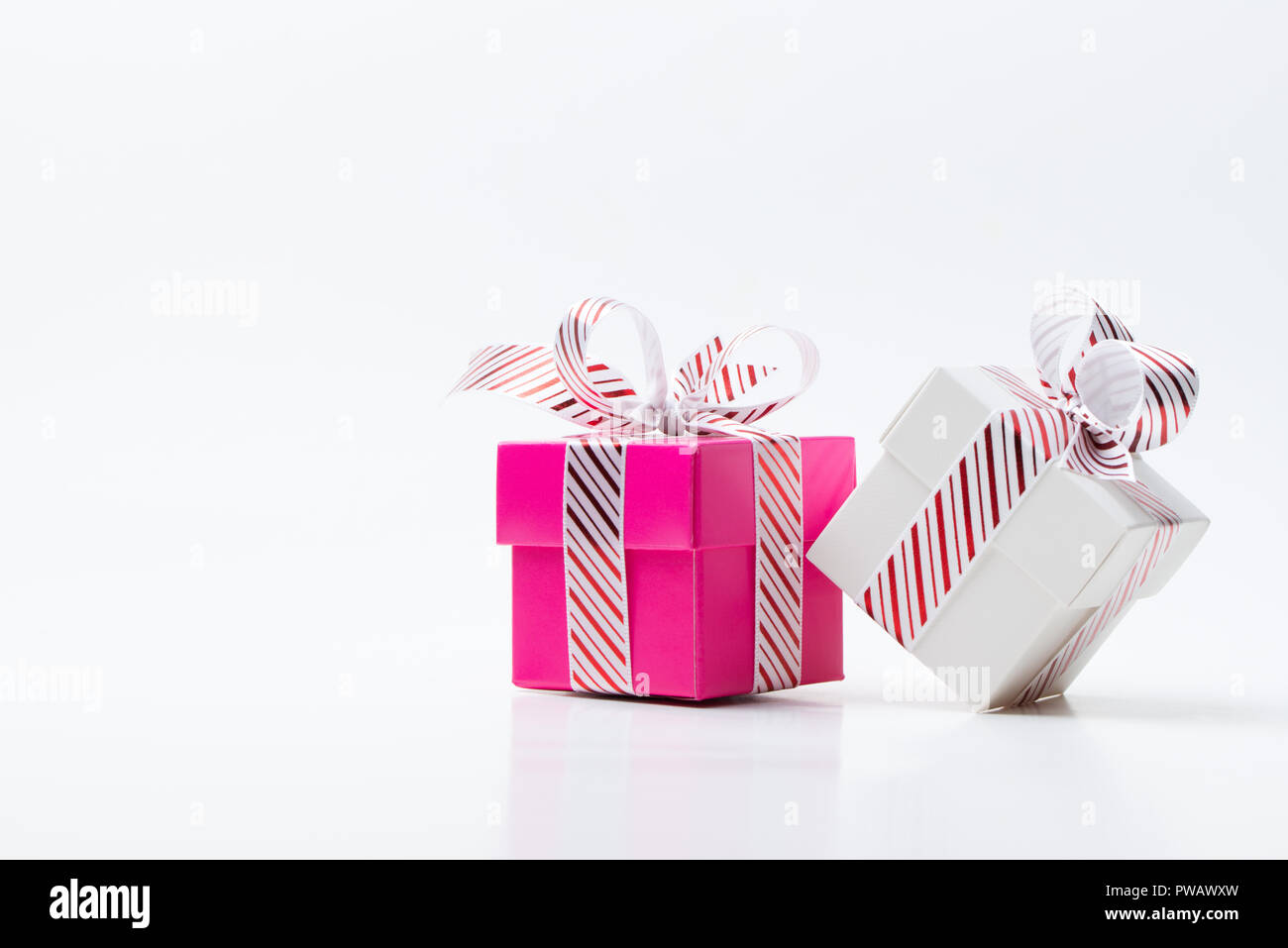 Gift box tied pink ribbon hi-res stock photography and images - Alamy
