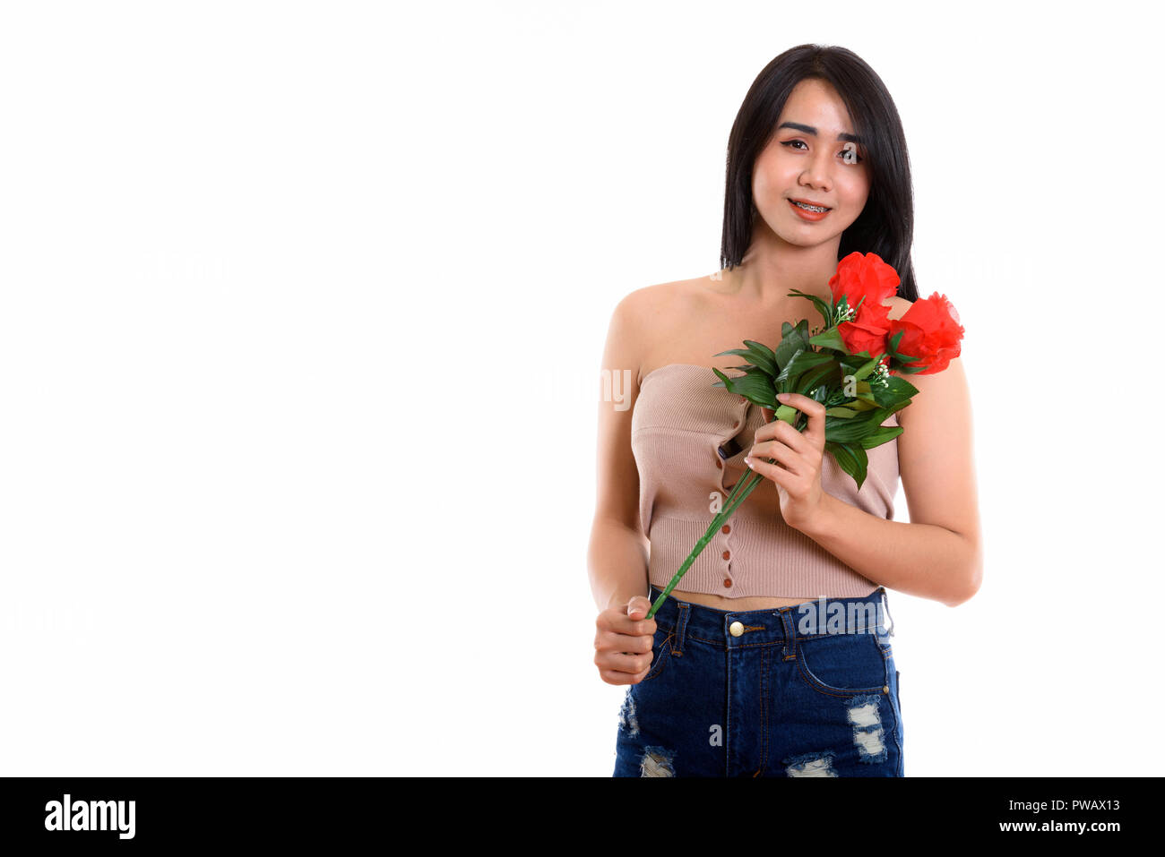 Studio shot of young happy Asian transgender woman smiling while Stock ...