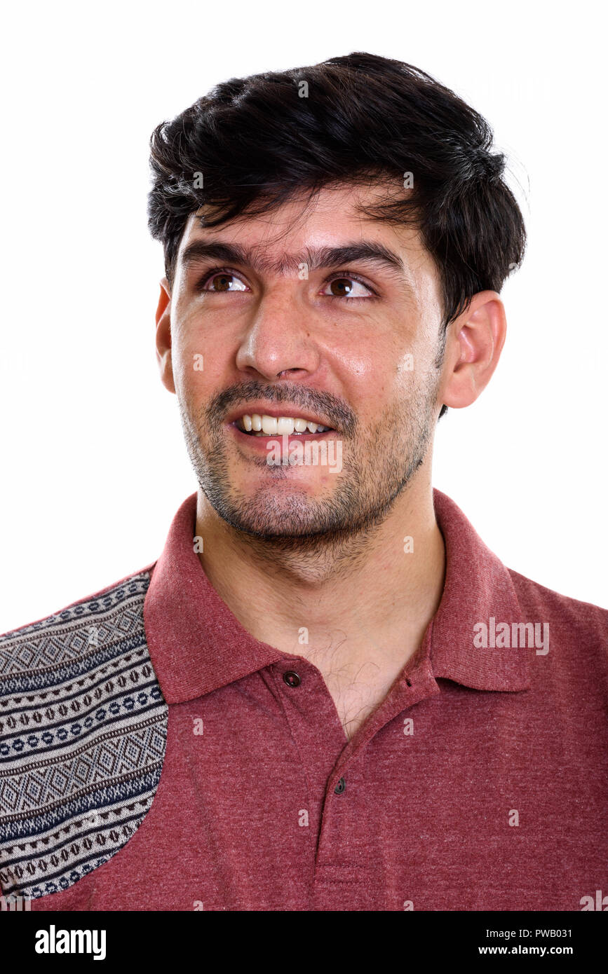 Face of young happy Persian man smiling and thinking while looki Stock ...