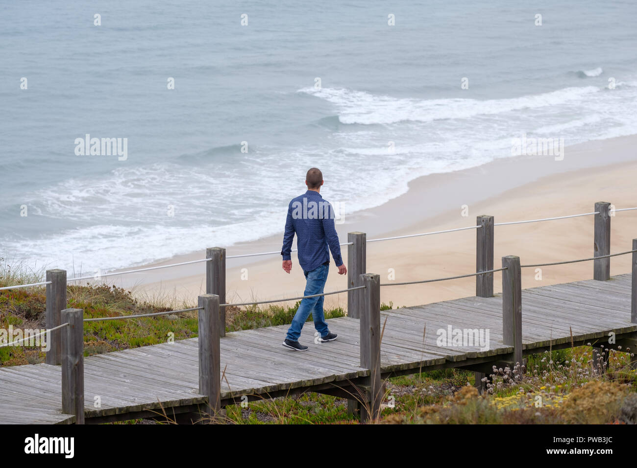 Teenager walking on the beach hi-res stock photography and images - Alamy