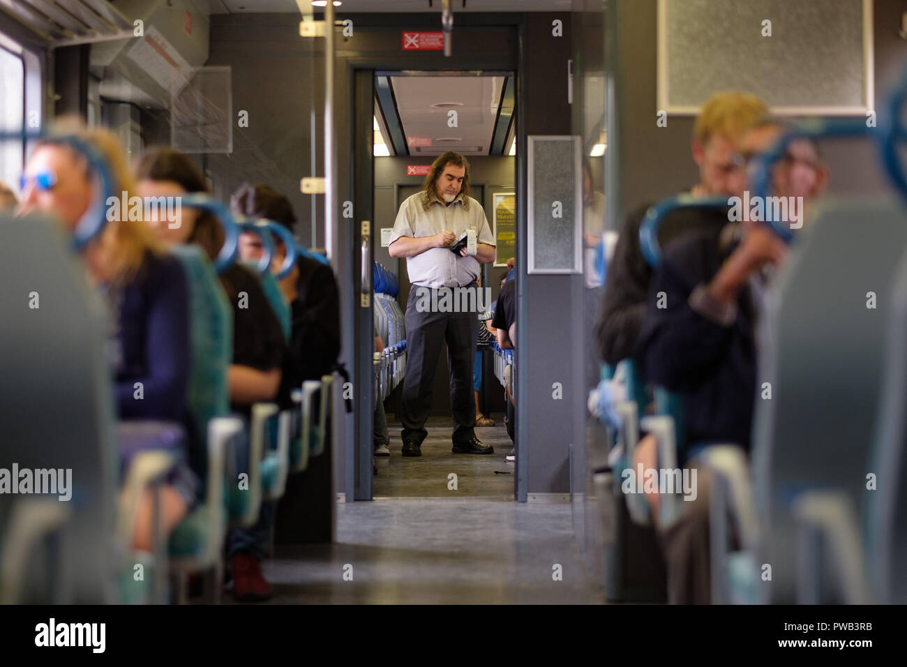 Passenger train conductor hi-res stock photography and images - Alamy
