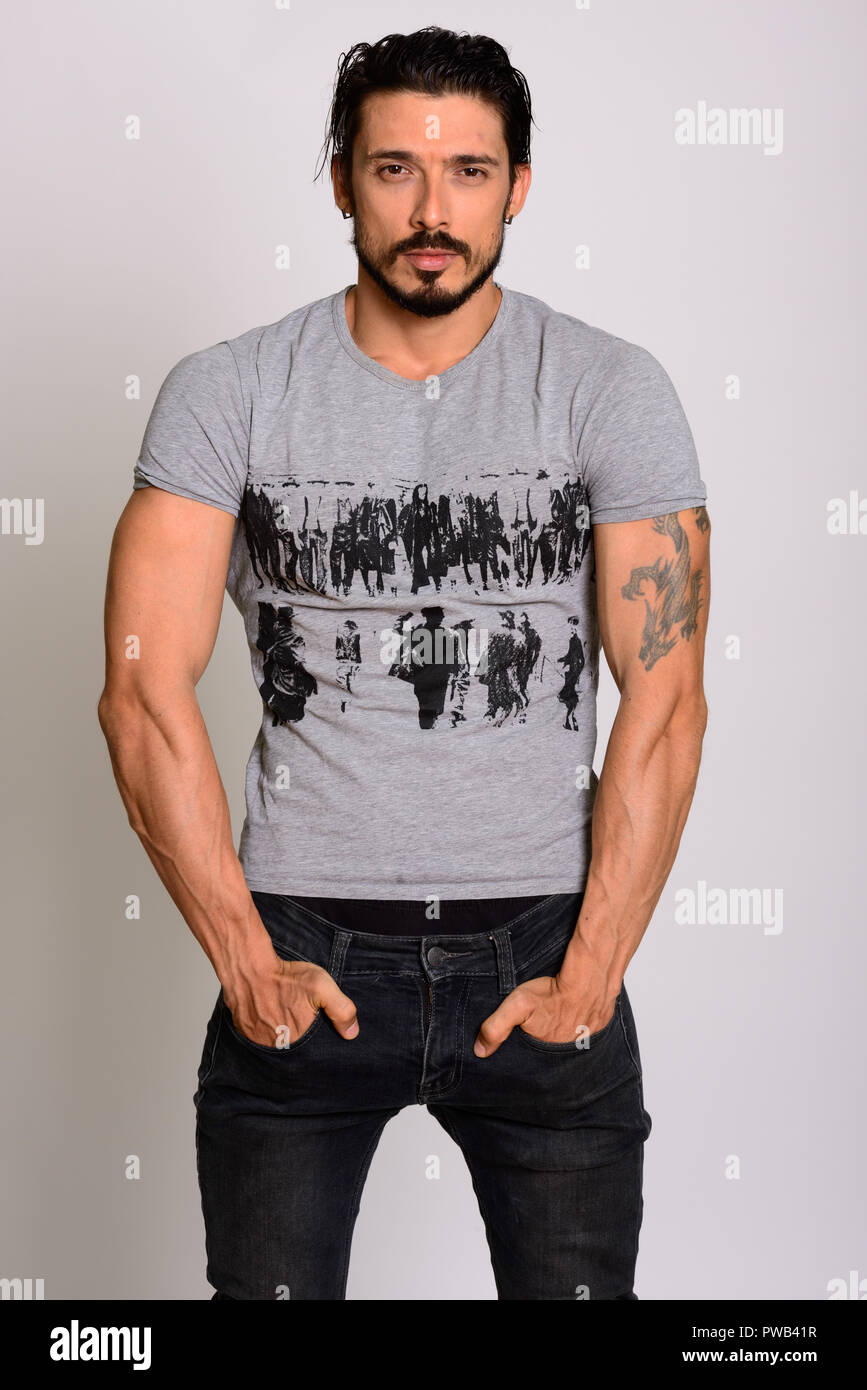 Studio shot of handsome muscular man posing Stock Photo - Alamy