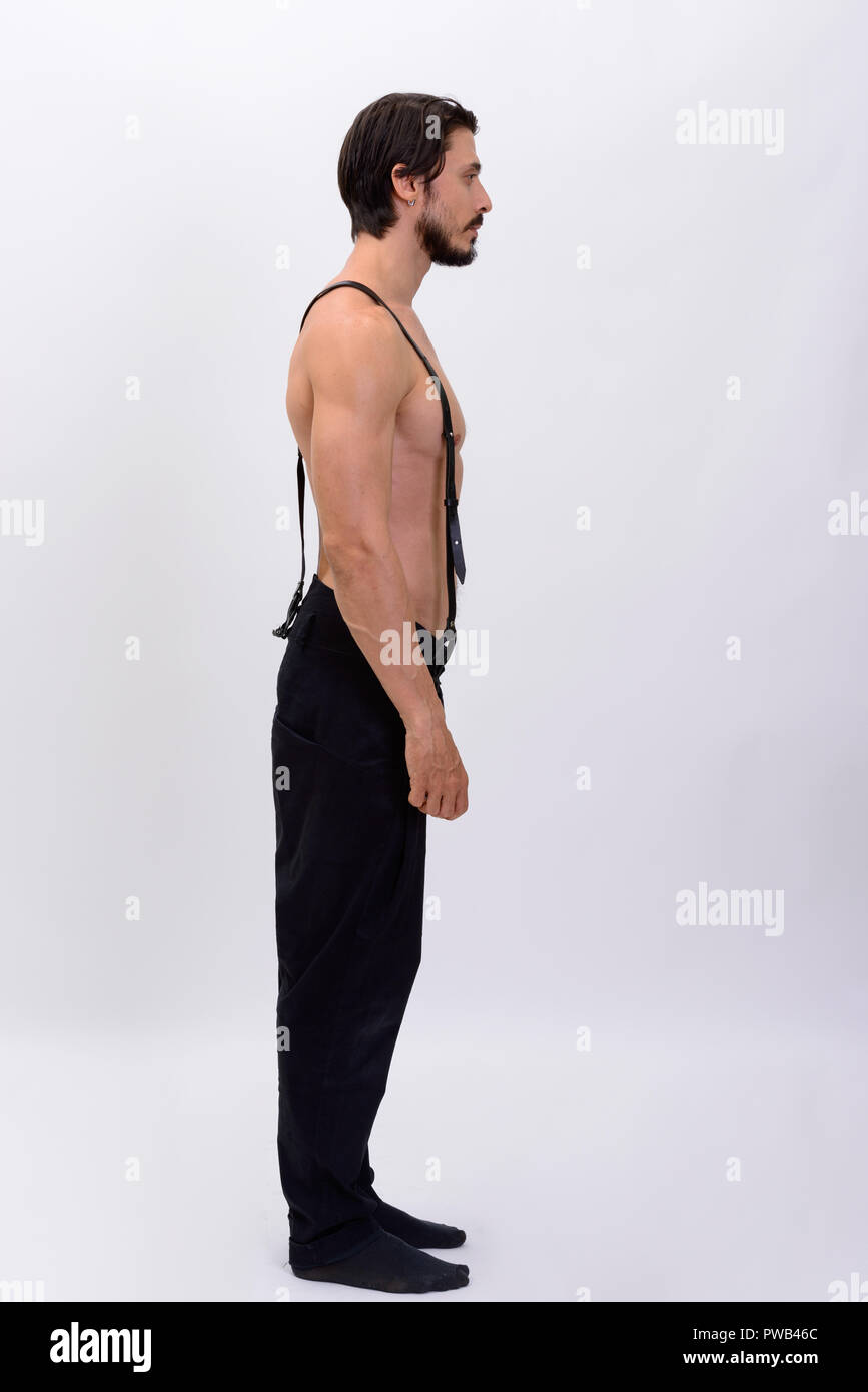 Full body shot profile view of handsome muscular man with suspe Stock ...