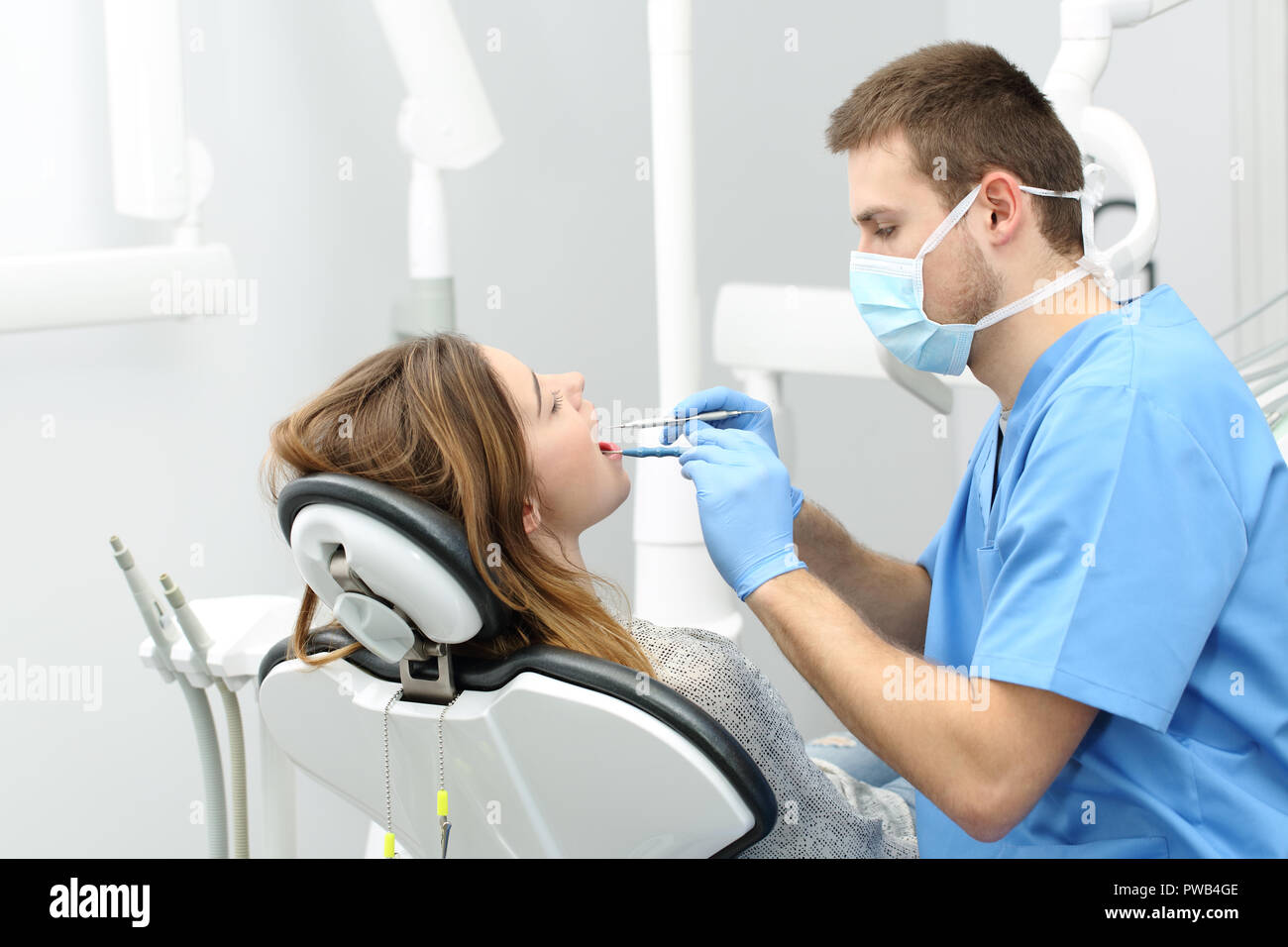 Male Dental Hygienist At Work male-dental-hygienist-at-work