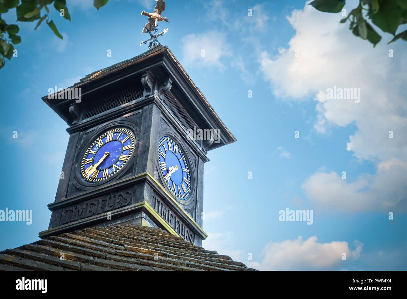 A vintage wooden clock tower Stock Photo - Alamy