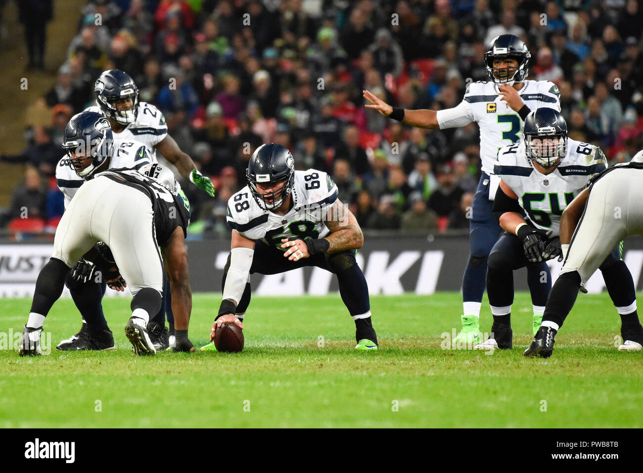 Football center snap ball hi-res stock photography and images - Alamy