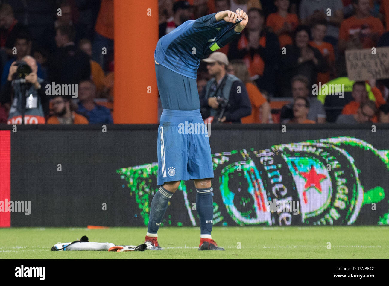 goalkeeper Manuel NEUER (GER) takes off his shirt, disappointed ...