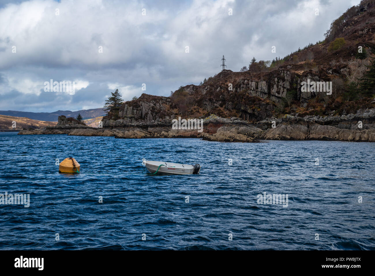 A boat next to a buoy in the Strait of Kyle Rhea, Kylerhea, Glenelg ...