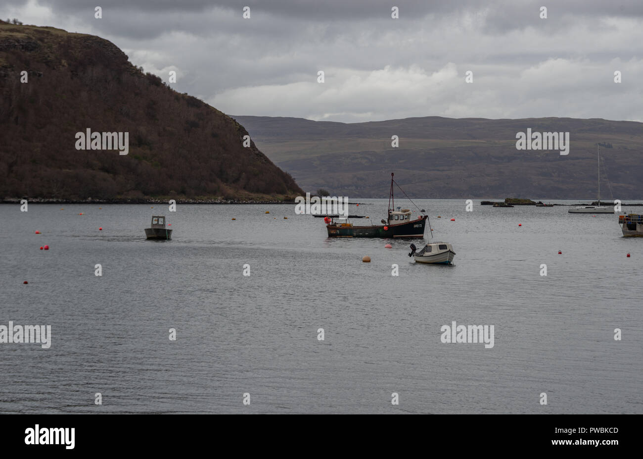 Boats and ships in the old Harbor of Portree, Isle of Skye, Scotland ...