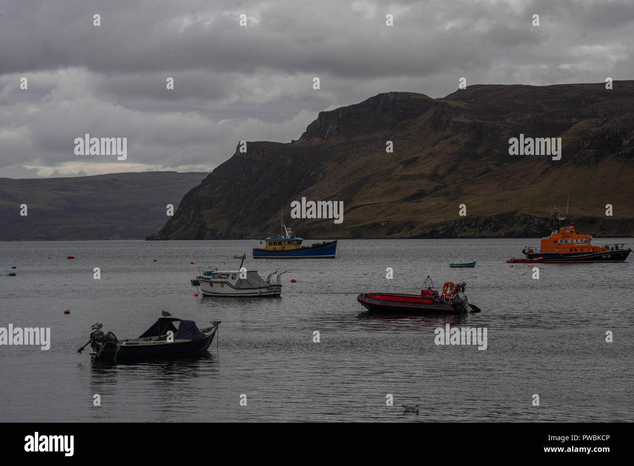 Boats and ships in the old Harbor of Portree, Isle of Skye, Scotland ...
