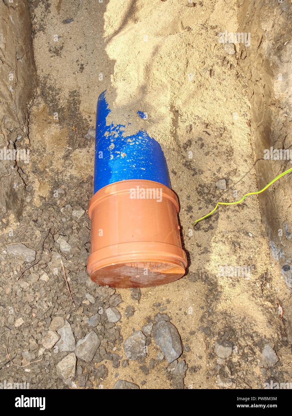 Laying of HDPE pipe underground of City portable water system. . Blue ...