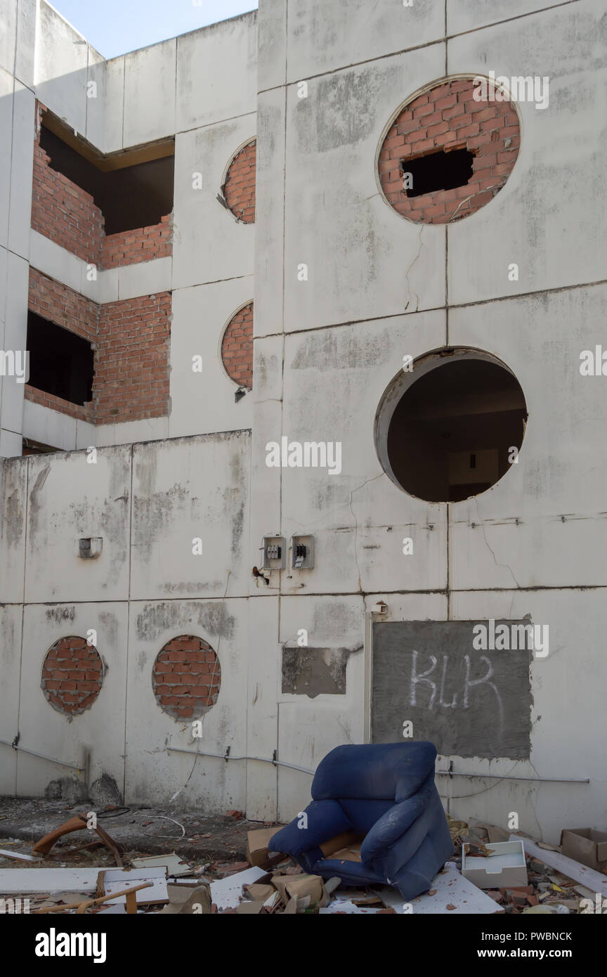 Facade of a abandoned and ruined building. Place dismantled, walled and ...