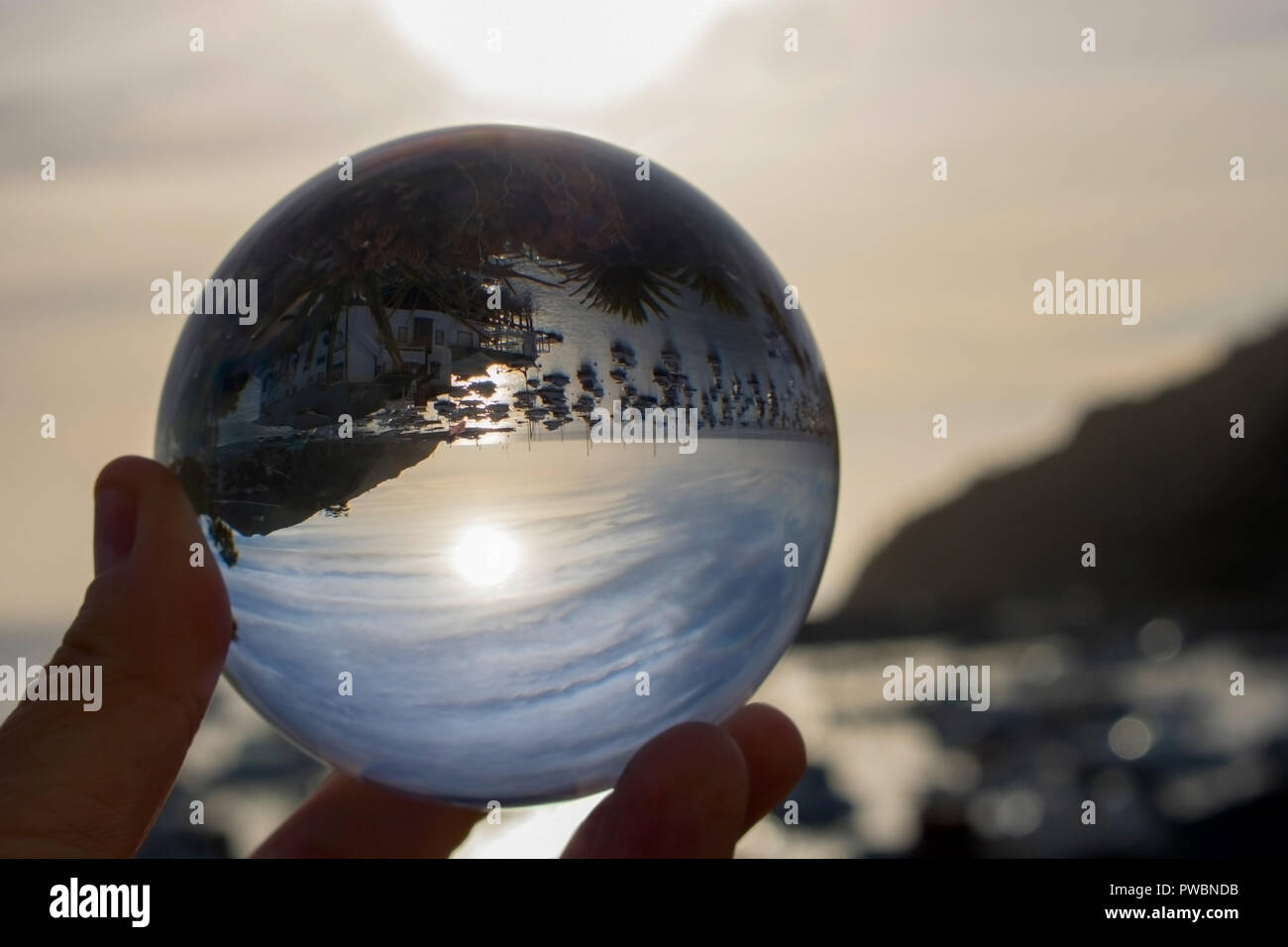Morning at harbor full of boats with sun and clouds captured in ...