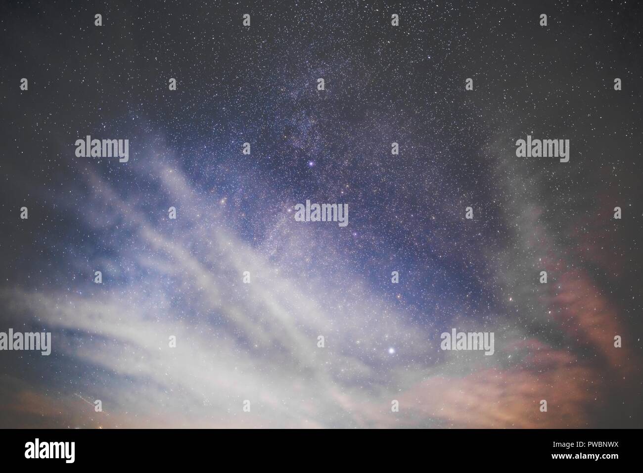 Starry sky and clouds Stock Photo - Alamy
