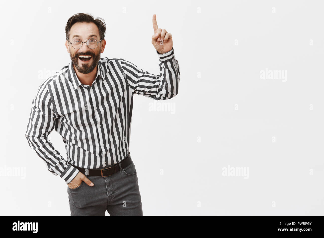 Businessman pointing towards camera and smiling Stock Photo - Alamy