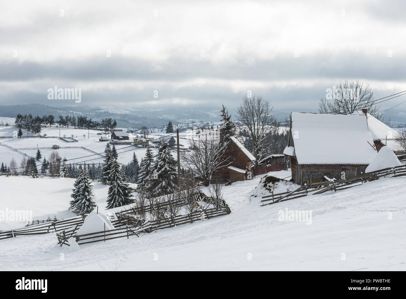 Alpine village in Transylvania, Romania. Snow covered houses in ...