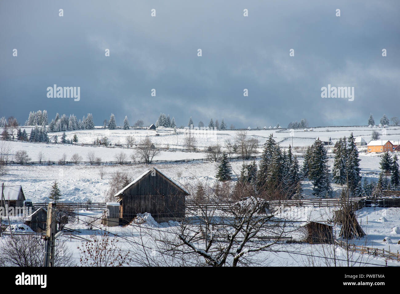 Alpine village in Transylvania, Romania. Snow covered houses in ...