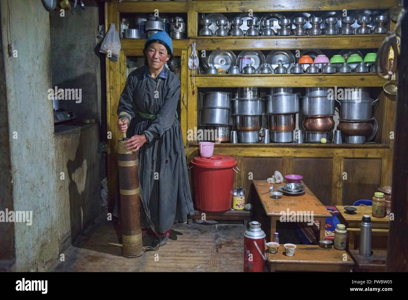 Old woman making Tibetan butter tea, Lamayuru, Ladakh, India Stock ...