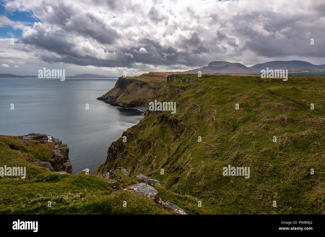 Steep cliffs at the shore near Kilt Rock and the Lealt Falls, Isle of ...