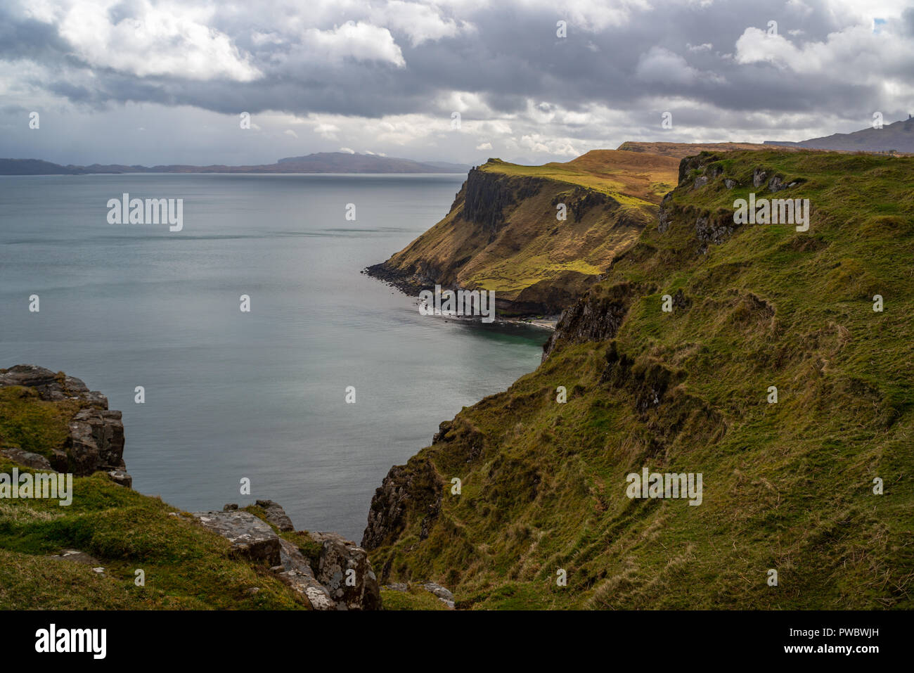 Steep cliffs at the shore near Kilt Rock and the Lealt Falls, Isle of ...