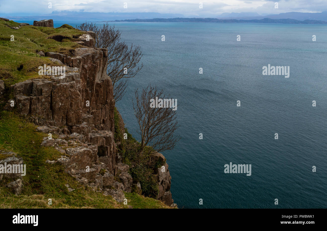 Steep cliffs at the shore near Kilt Rock and the Lealt Falls, Isle of ...
