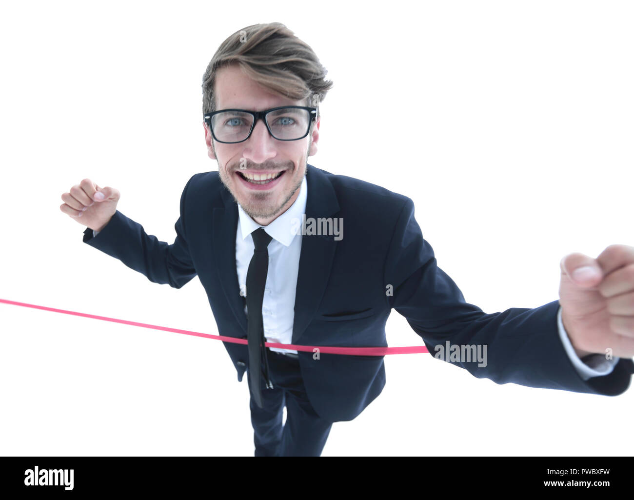 Cheerful businessman crossing red finish line Stock Photo - Alamy