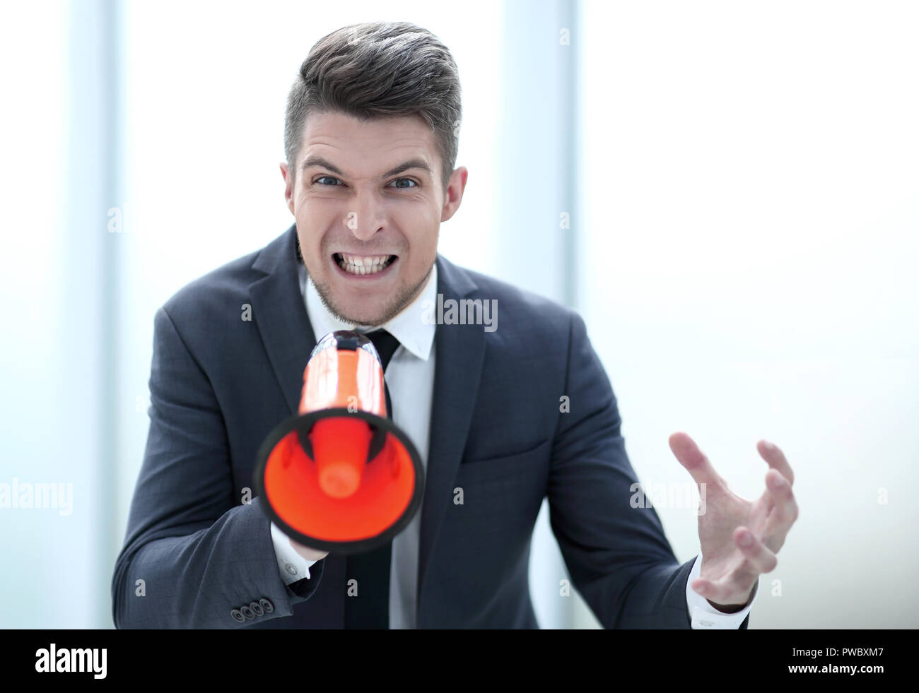 portrait of young man handsome shouting using megaphone Stock Photo - Alamy
