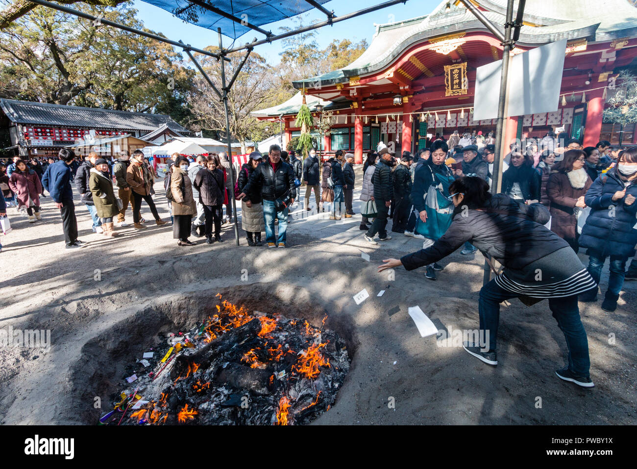 Japanese new year, shogatsu. People praying in front of bonfire used to ...
