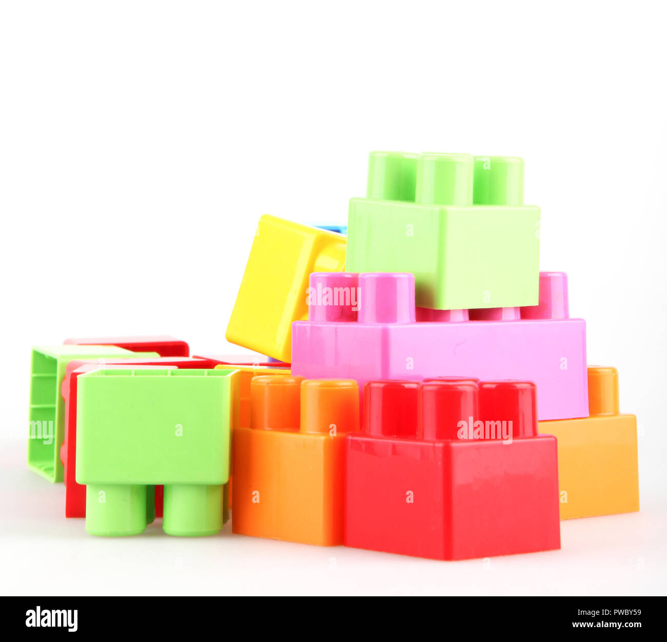 Plastic colorful toy blocks on white background Stock Photo - Alamy