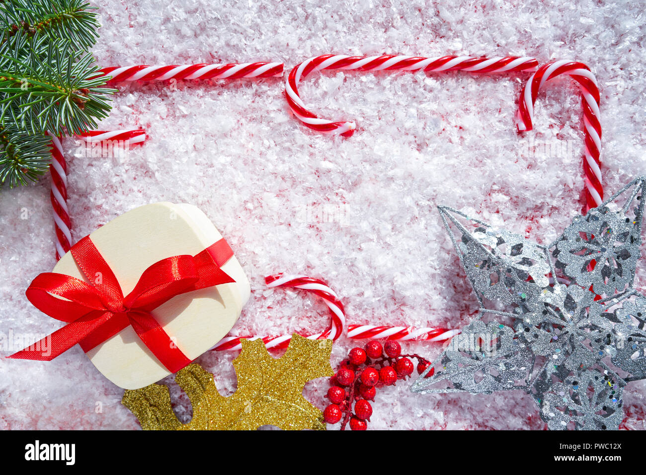 Christmas gift and candy cane frame on snow background border Stock ...