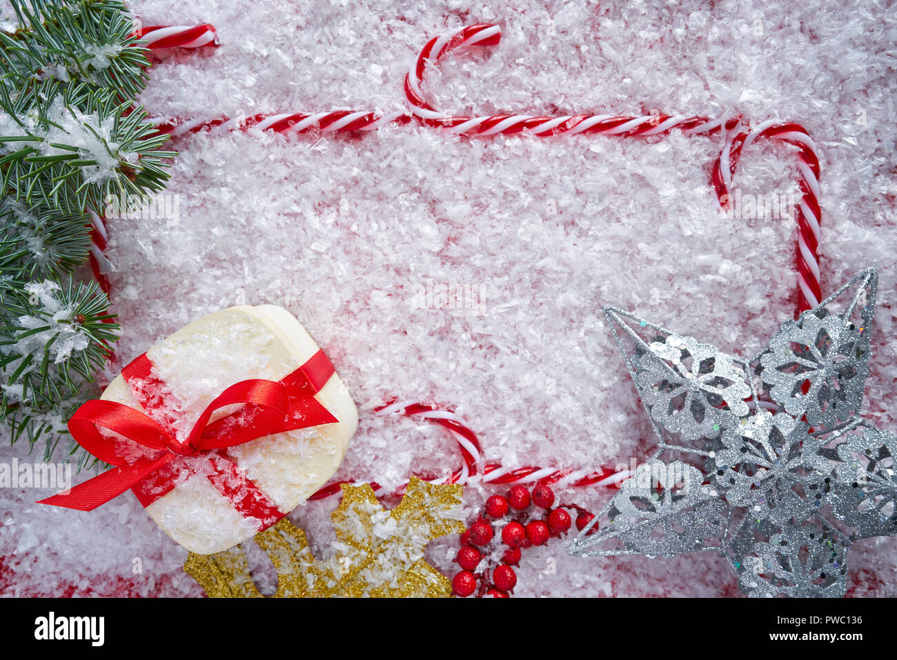 Christmas gift and candy cane frame on snow background border Stock ...