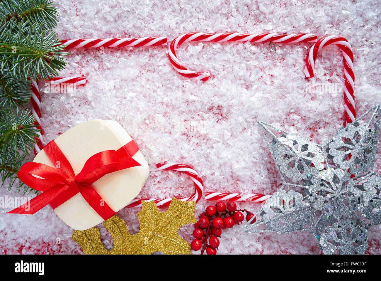 Christmas gift and candy cane frame on snow background border Stock ...