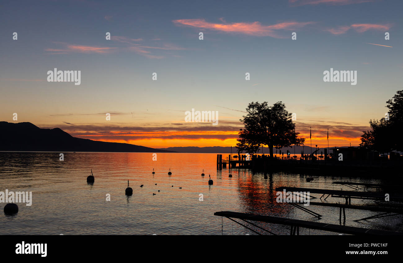 Sunset light over Geneva Lake. Beautiful view on multicolor sky on ...