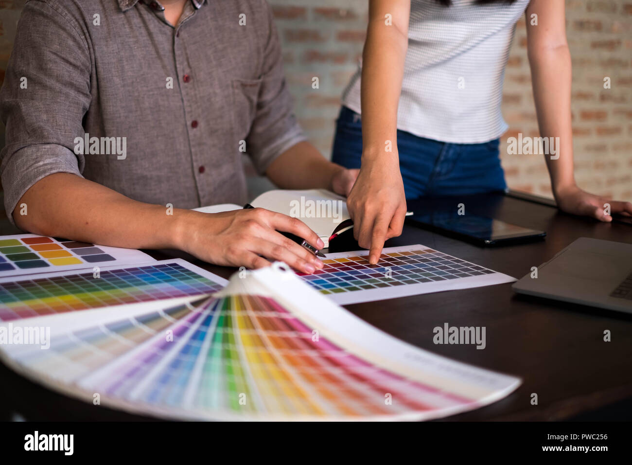 Graphic designers choose colors from the color bands samples for design ...