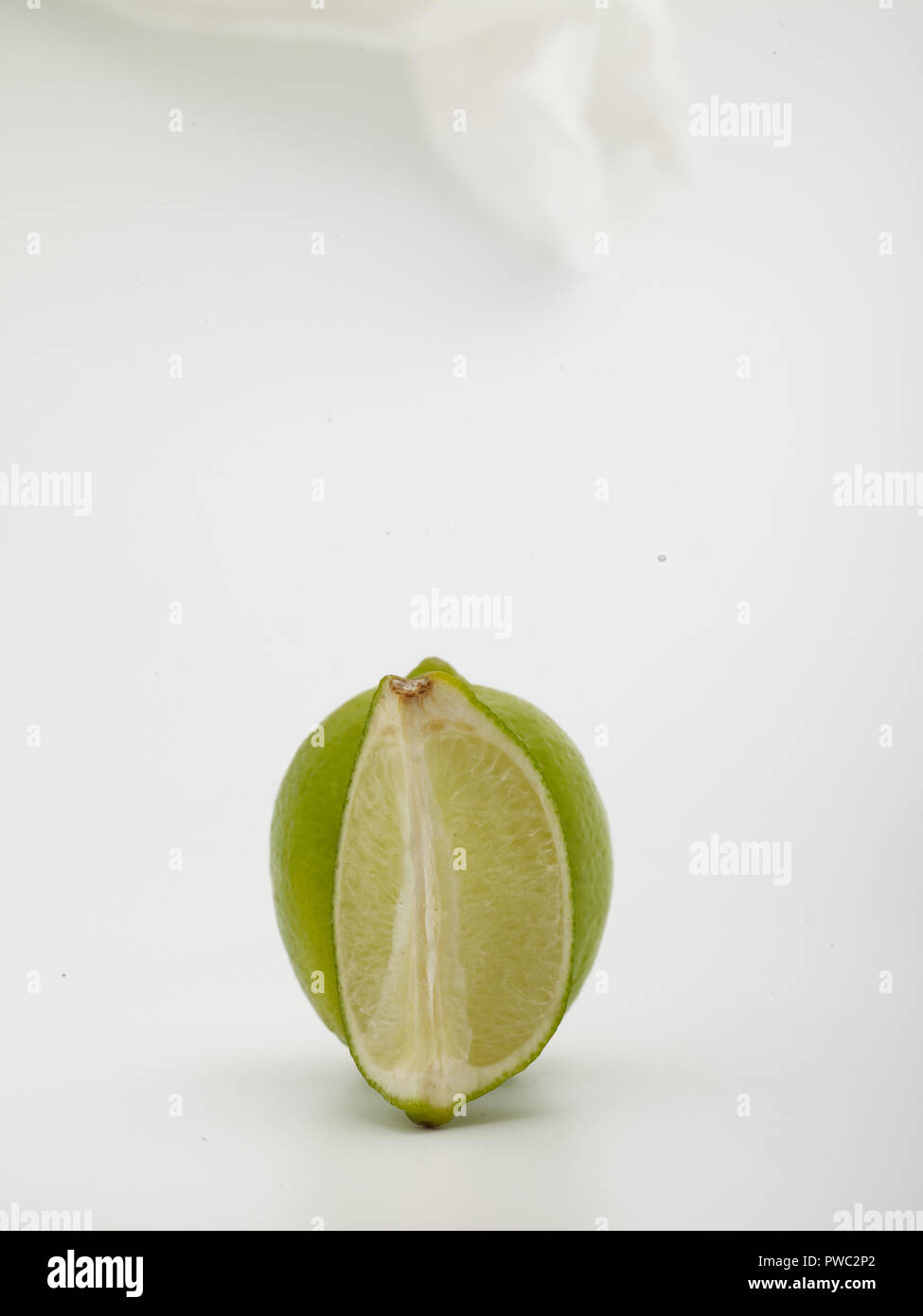 Lime food still-life on plain background Stock Photo - Alamy
