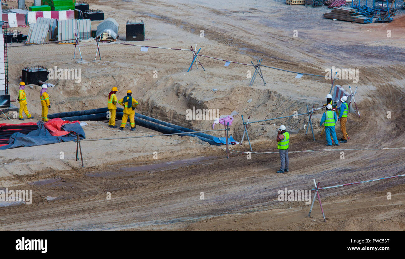construction site with workers at pipes Stock Photo - Alamy