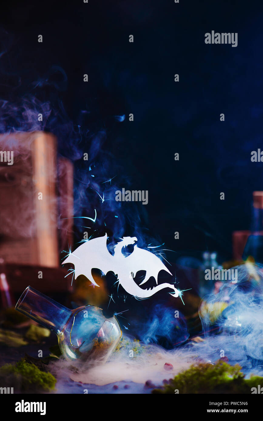 Glowing dragon in a magical still life with copy space Stock Photo - Alamy