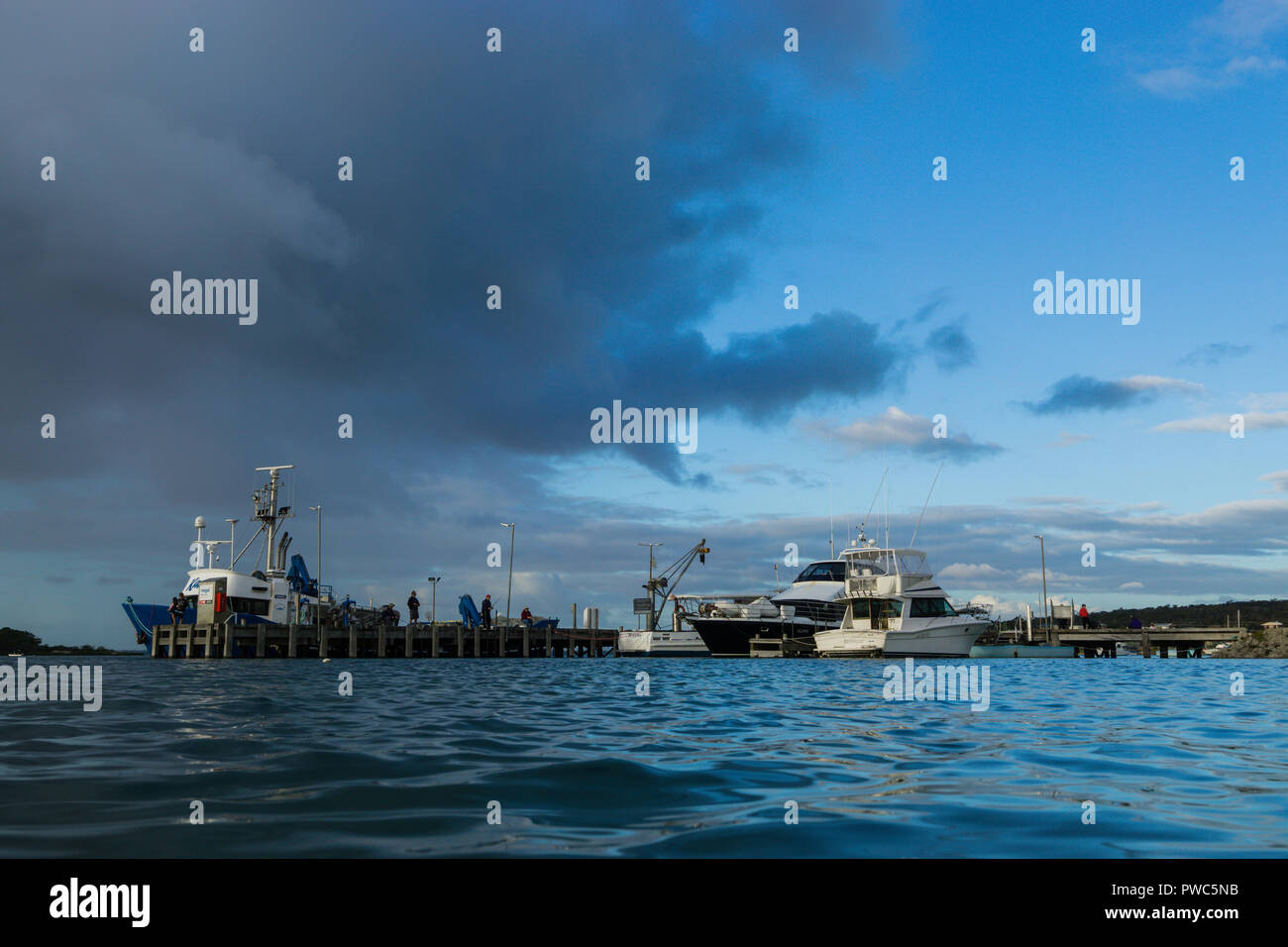 Fishing boats and pleasure craft moored at Coffin Bay wharf Coffin Bay ...