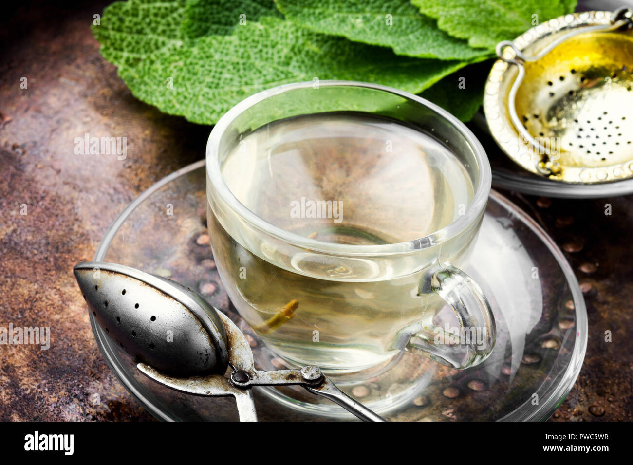 Brewed delicious herbal tea with sage on retro background Stock Photo ...