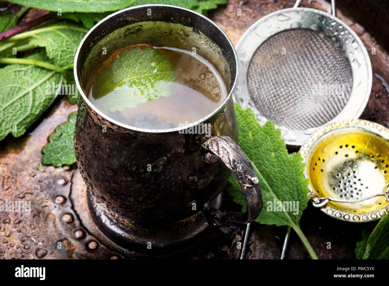 Brewed delicious herbal tea with sage on retro background Stock Photo ...