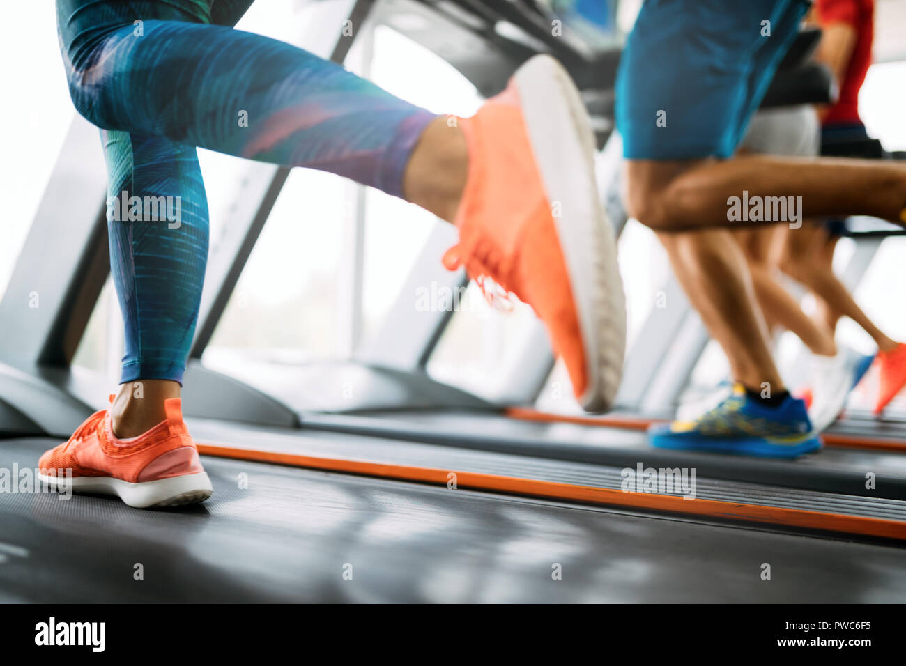 Picture of people running on treadmill in gym Stock Photo - Alamy