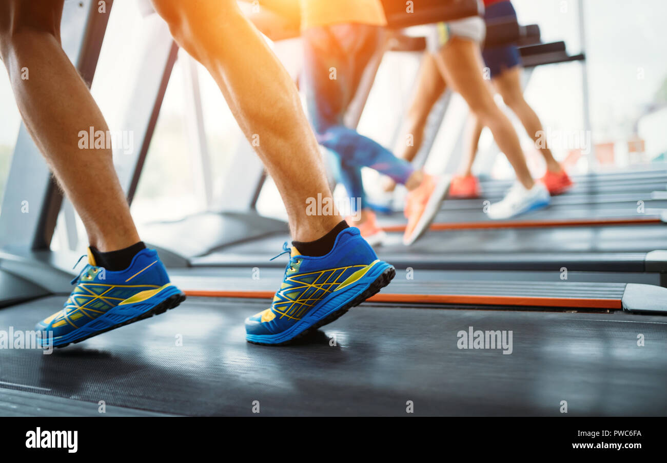 Picture of people running on treadmill in gym Stock Photo - Alamy