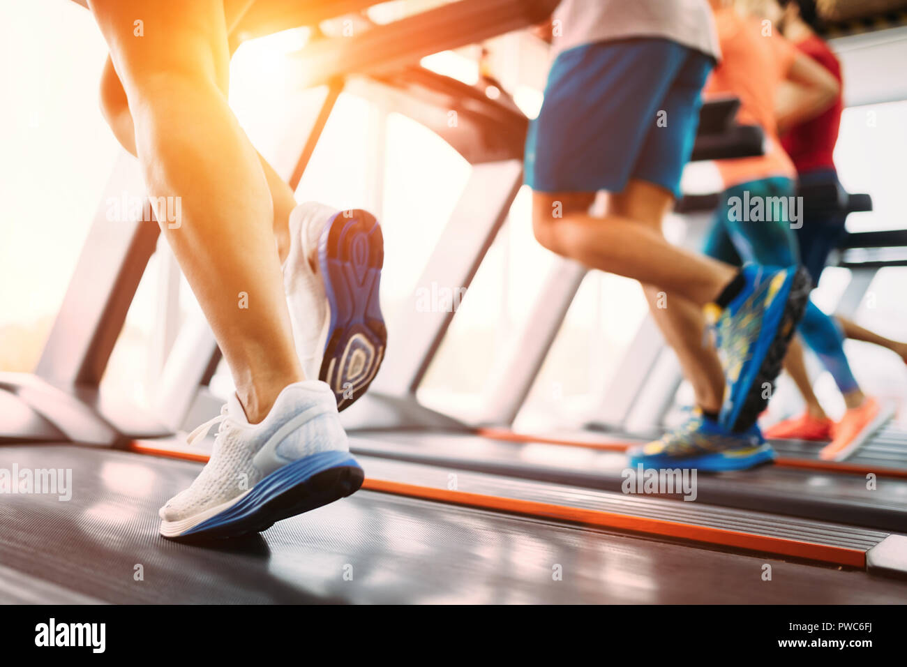 Picture of people running on treadmill in gym Stock Photo - Alamy
