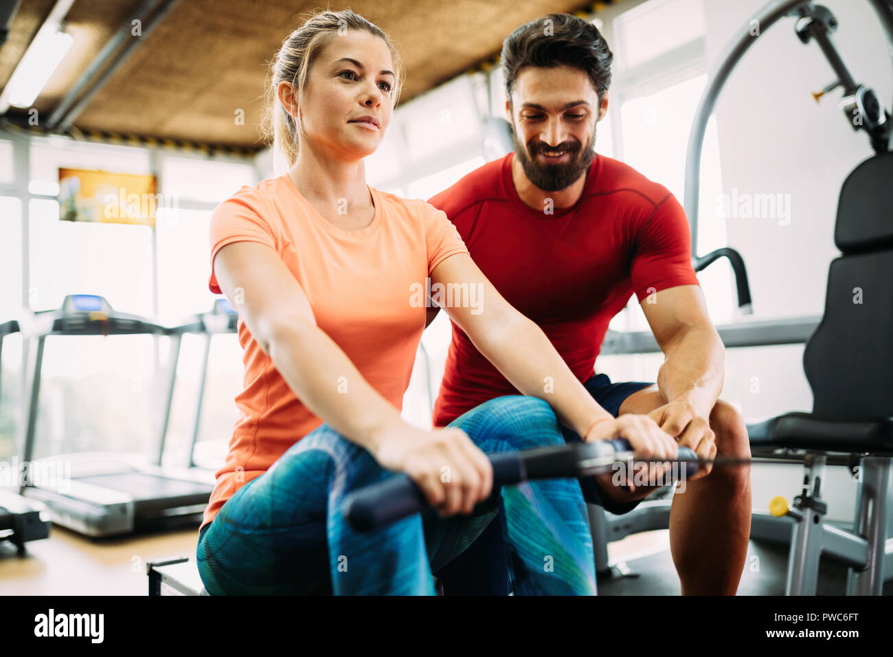 Woman workout with personal trainer trainer hi-res stock photography ...