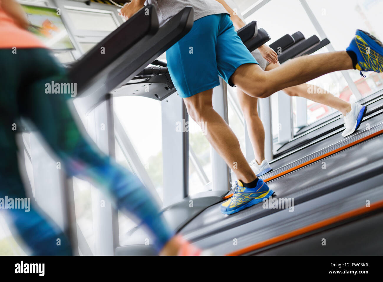 Picture of people running on treadmill in gym Stock Photo - Alamy