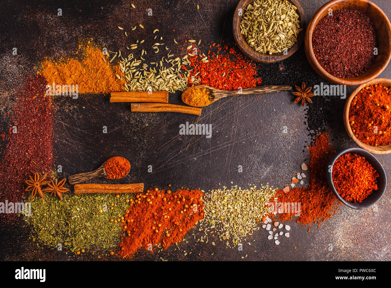 Different kind of spices on dark background. Food frame, top view, copy ...